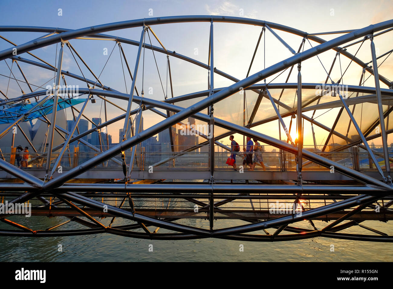 Sunset behind the Helix Bridge, inspired by the human DNA, connecting ...