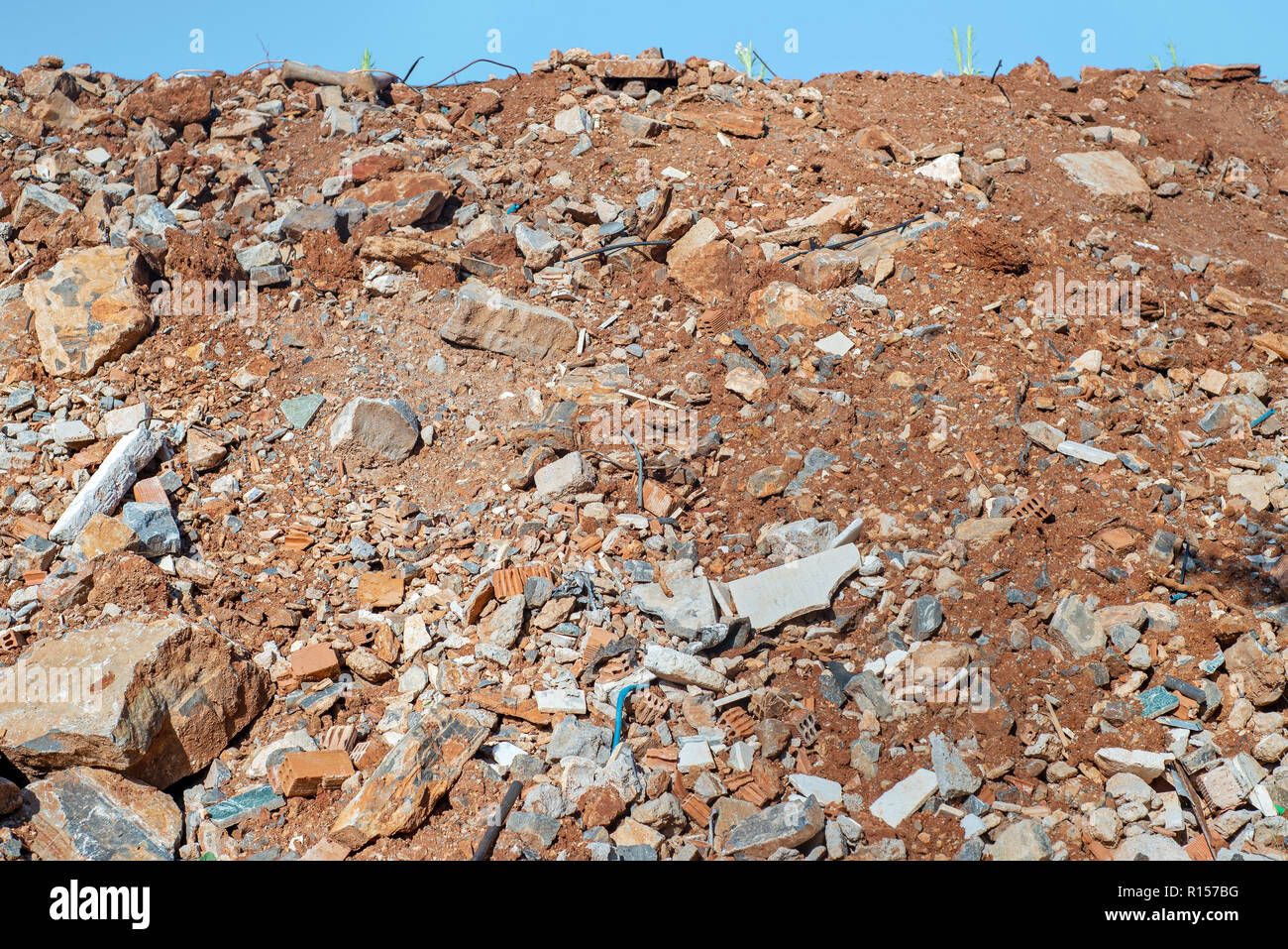 Construction and Demolition Debris. Blue sky background Stock Photo - Alamy