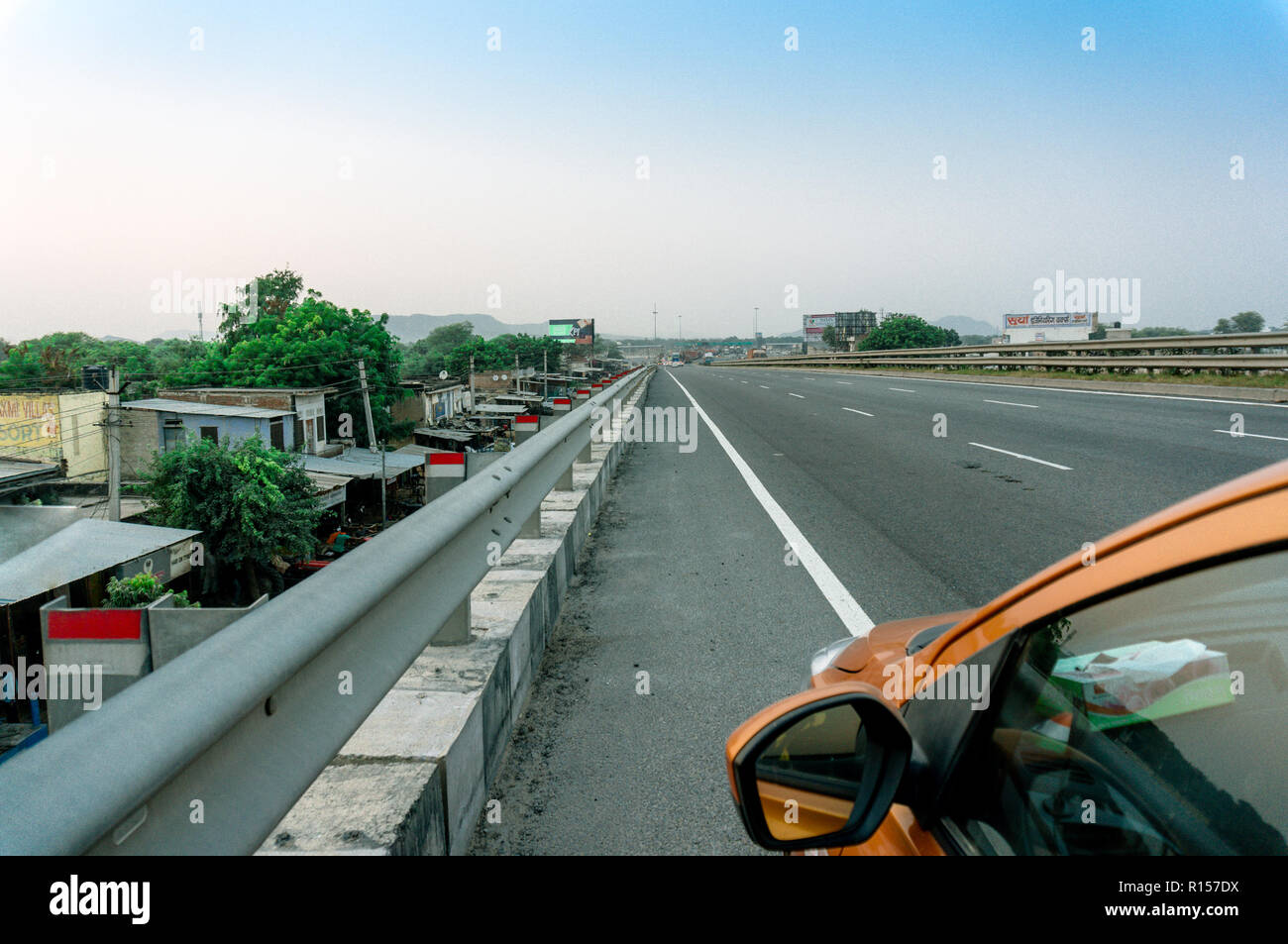Car facing off into the distance with a long highway. The beautiful ...