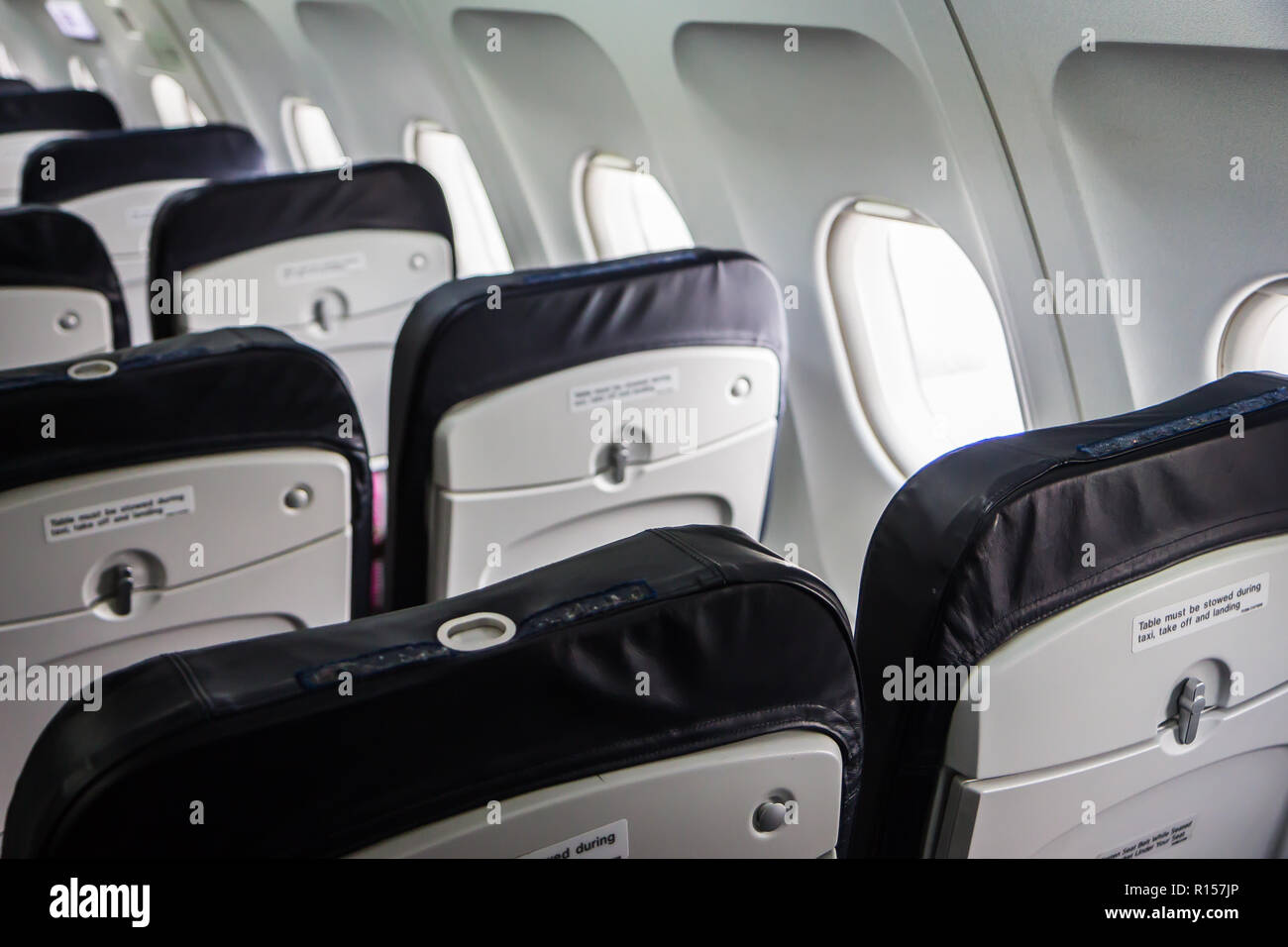Empty airplane seats in the cabin Stock Photo - Alamy