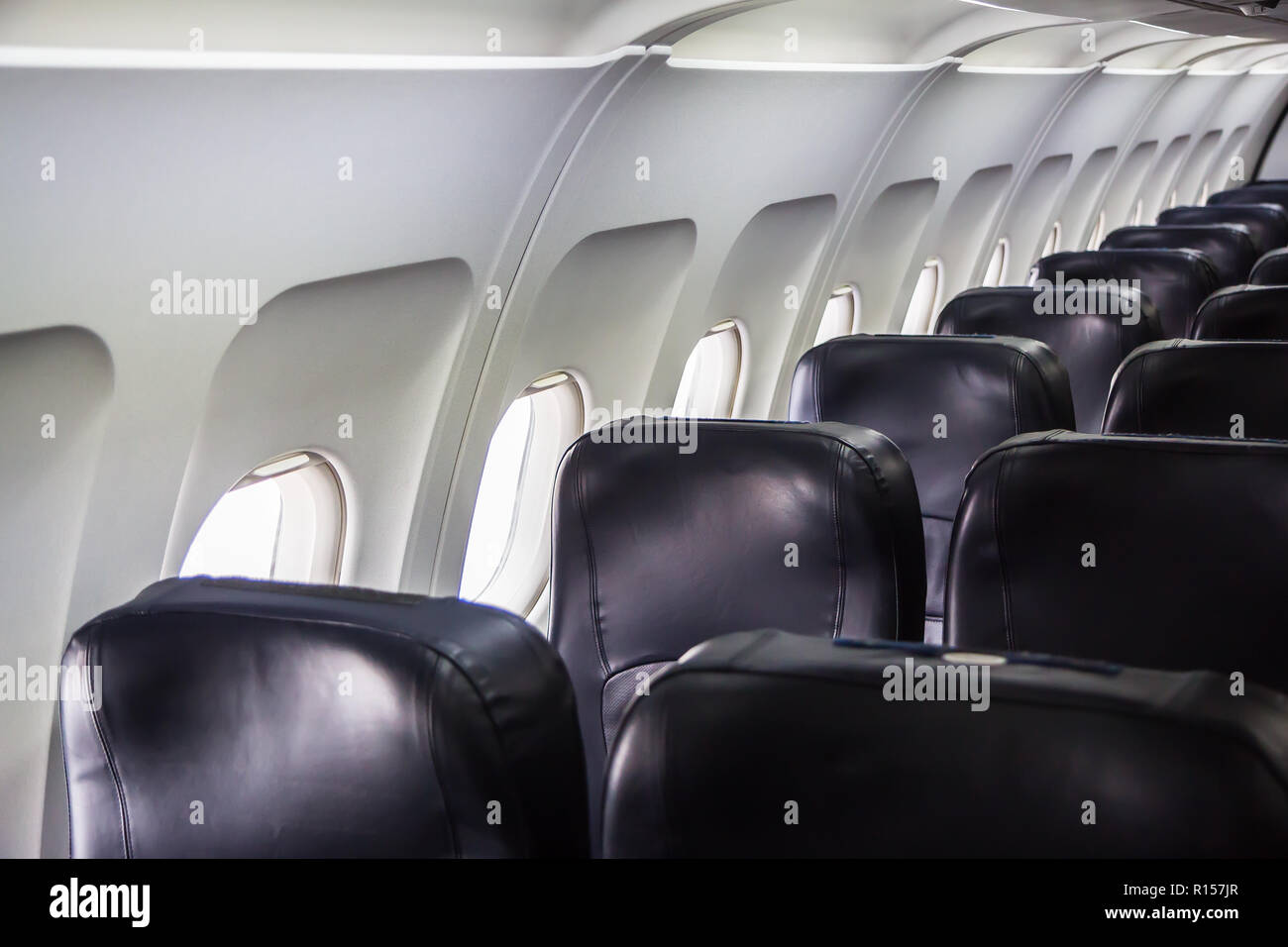 Empty airplane seats in the cabin Stock Photo - Alamy