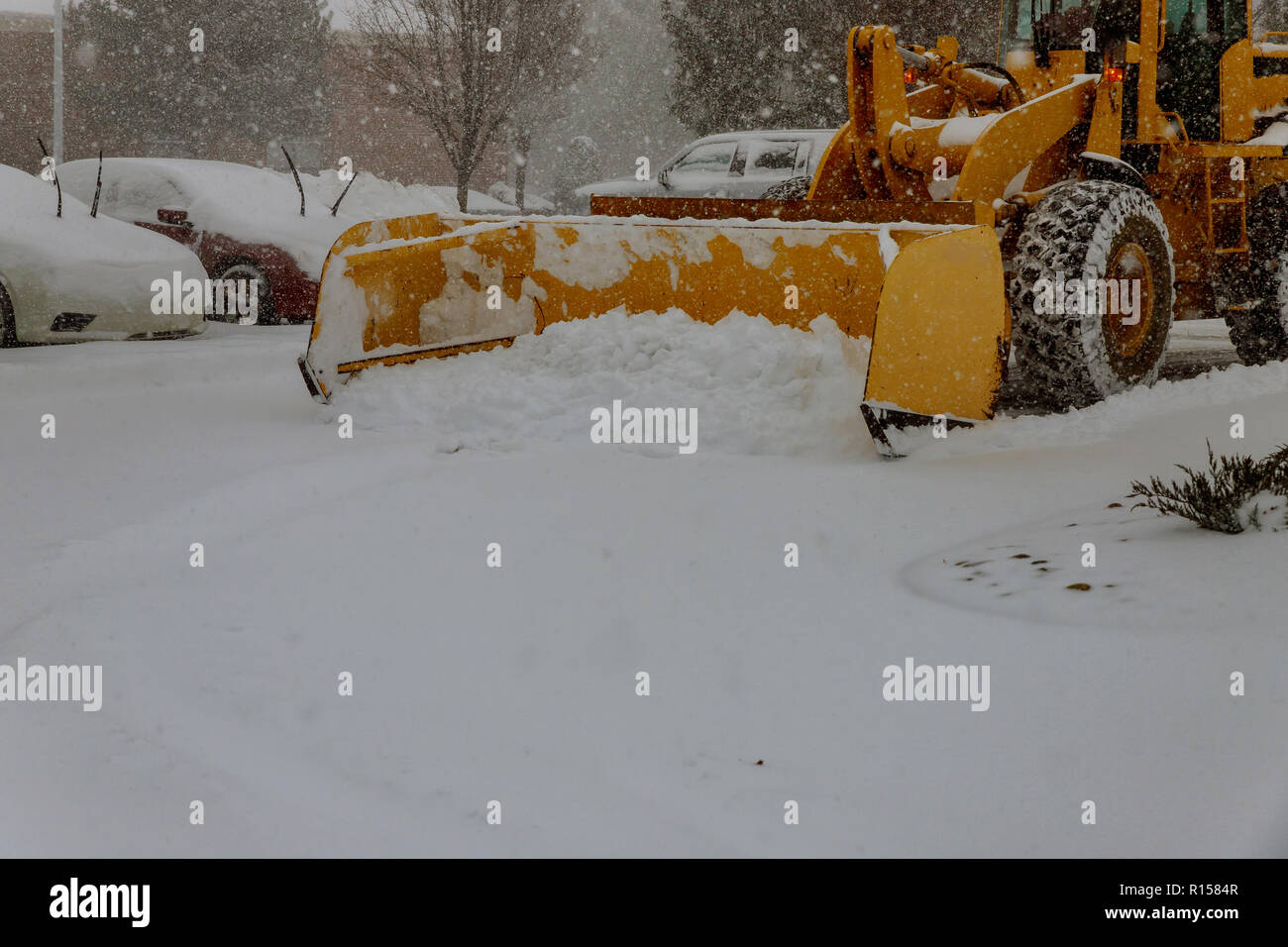 Wheel loader machine removing snow in winter Stock Photo - Alamy