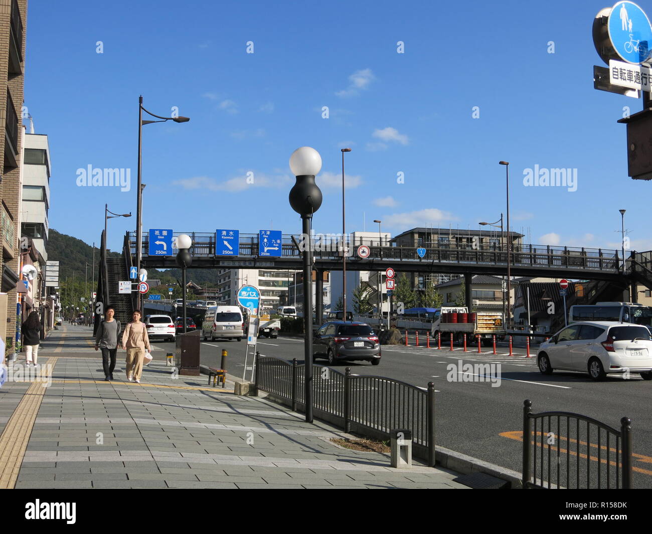 View of a main street in Kyoto, Japan, with overhead walkway, road ...