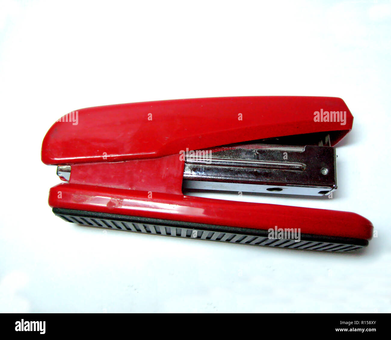 Red stapler isolated on the white background Stock Photo - Alamy
