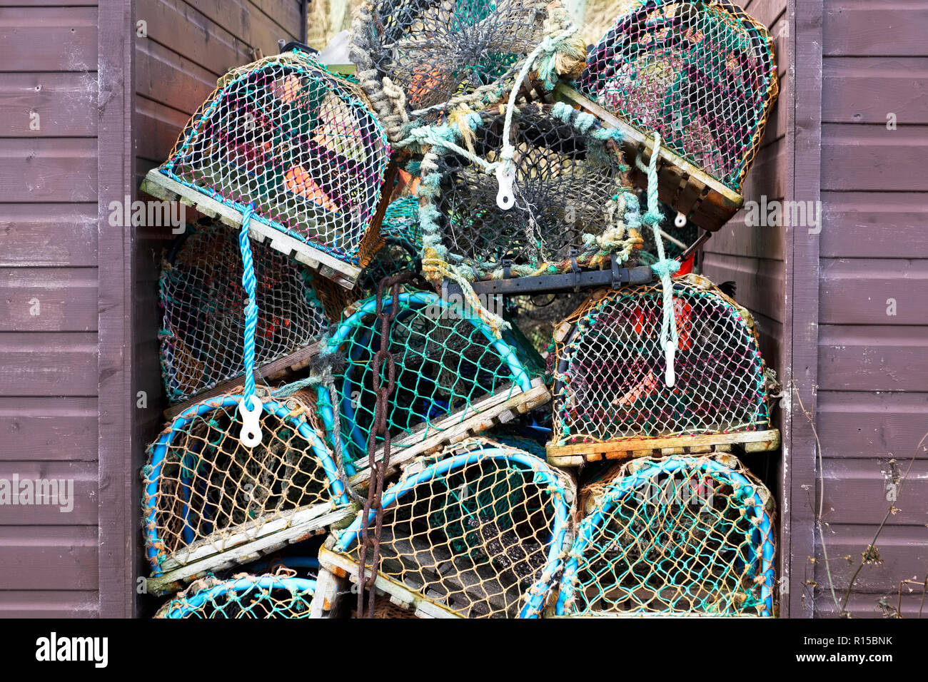 Lobster fishing pots nets stacked Stock Photo - Alamy