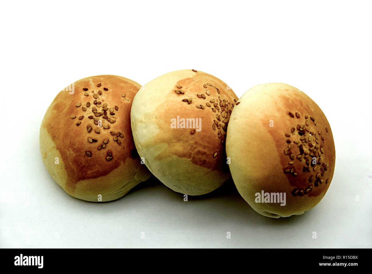 small breads with sesame Stock Photo - Alamy