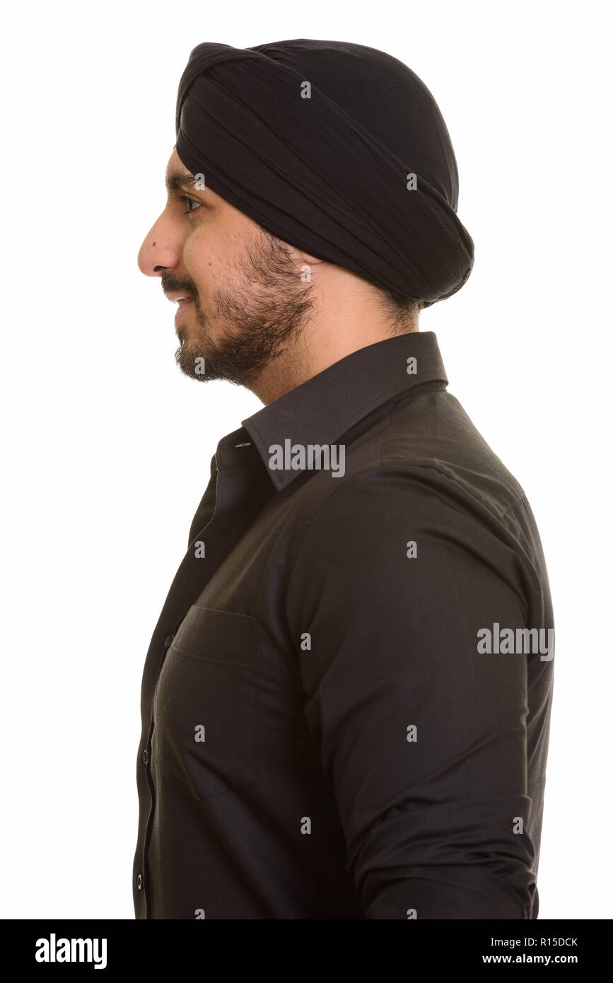 Profile view of young happy Indian Sikh smiling Stock Photo - Alamy