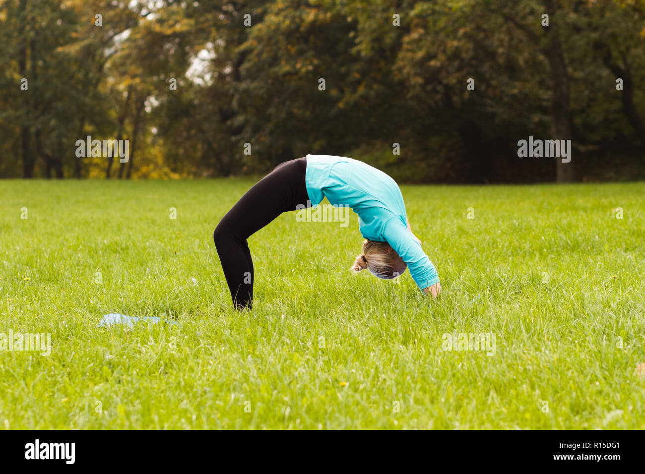 Yoga-Urdhva Dhanurasana/Upward bow pose Stock Photo - Alamy