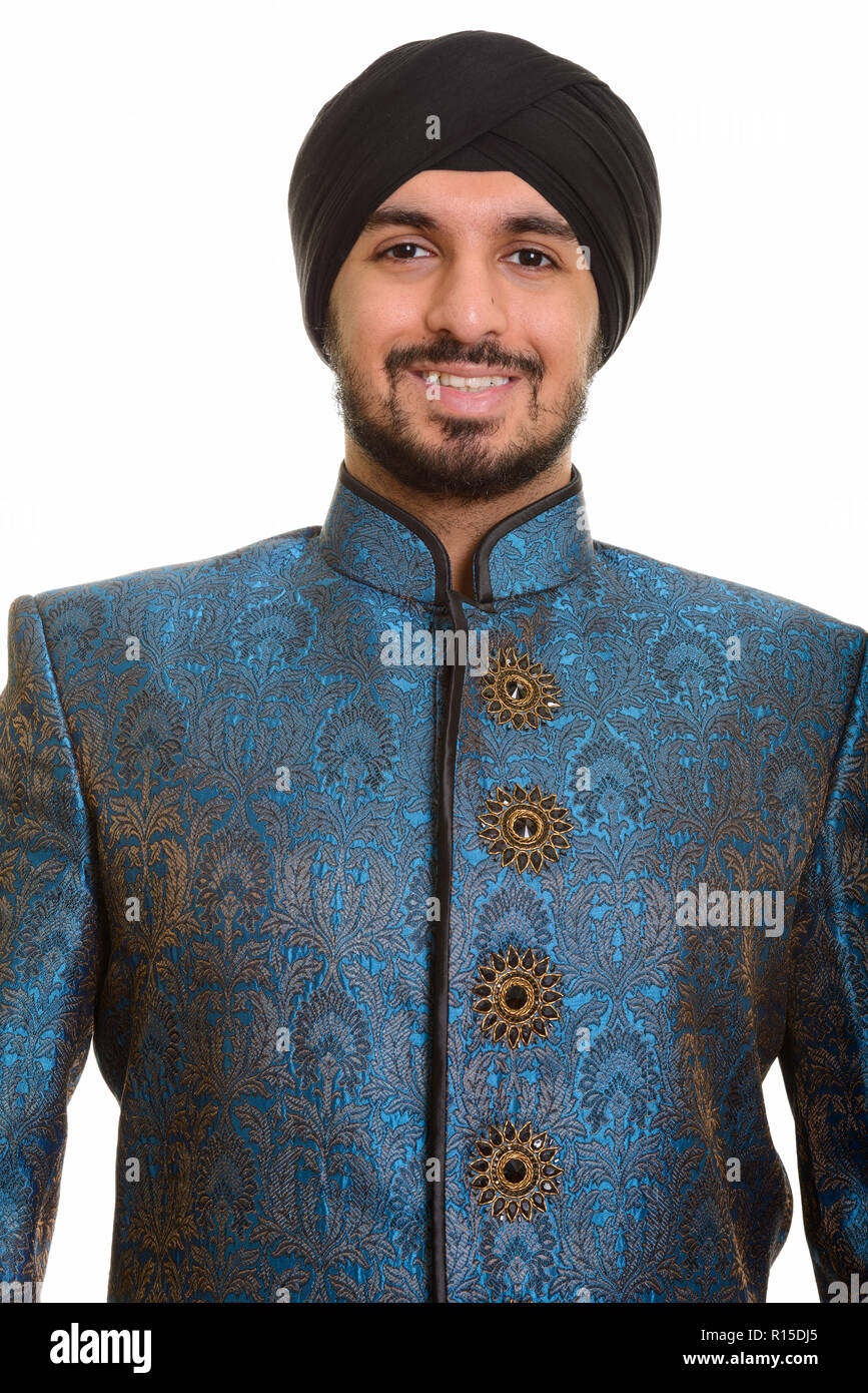Young happy Indian Sikh smiling wearing traditional clothes Stock Photo ...