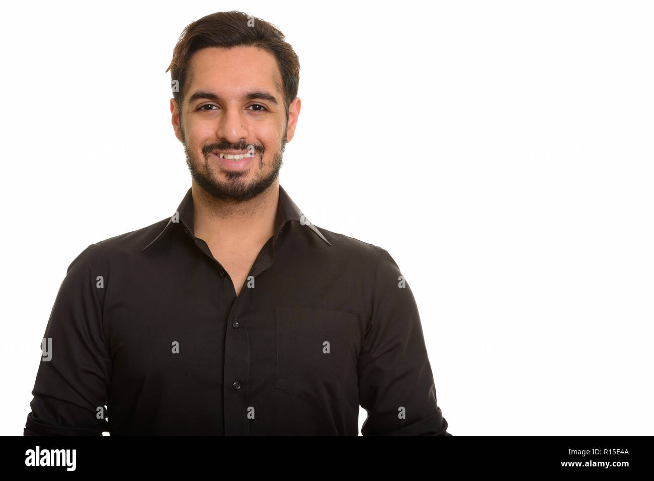 Young happy Indian man smiling and looking at camera Stock Photo - Alamy