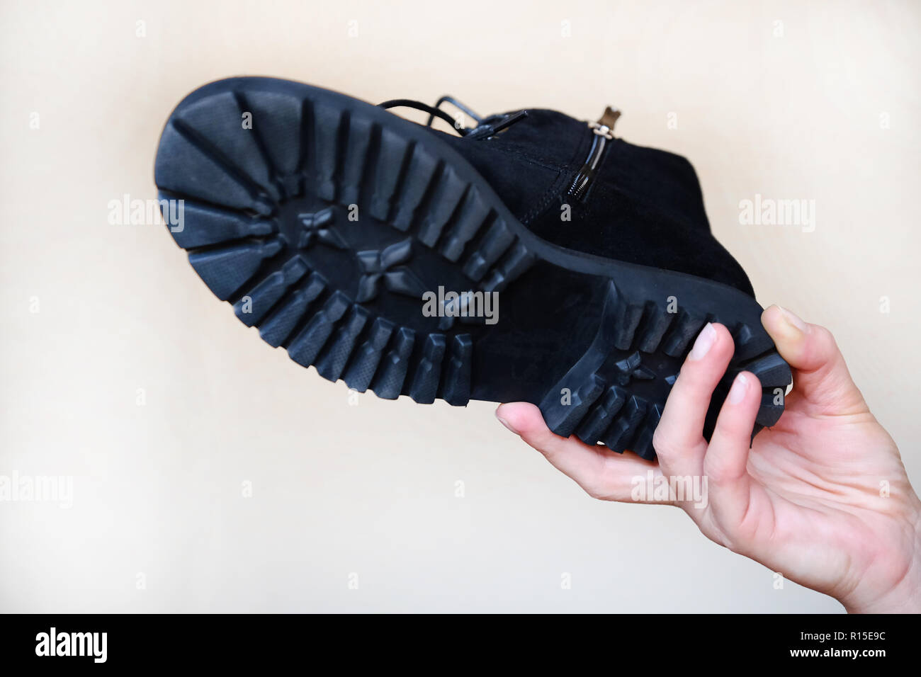 Shoe in hand hi-res stock photography and images - Alamy