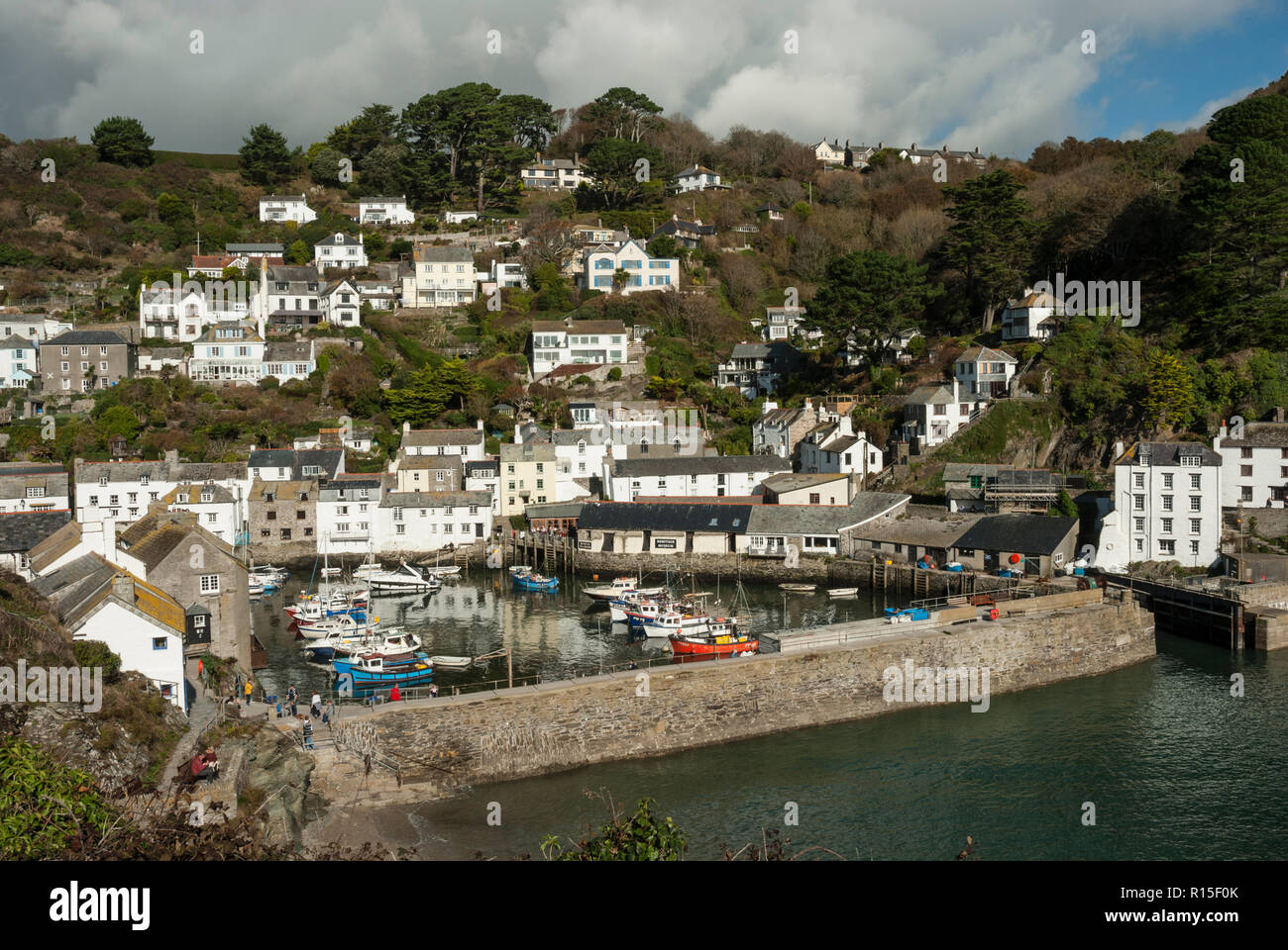 View of the pretty historic Cornish fishing village of Polperro with ...
