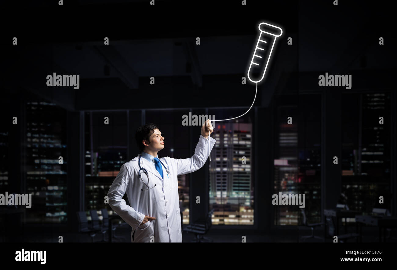 Doctor and medical vial symbol Stock Photo - Alamy
