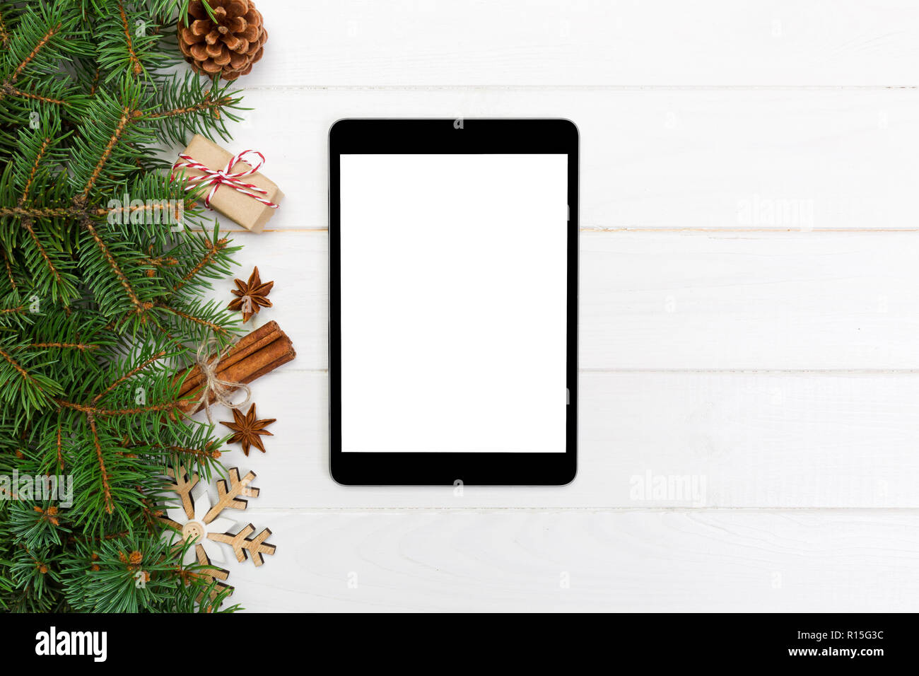 Digital tablet mock up with rustic Christmas wooden background ...