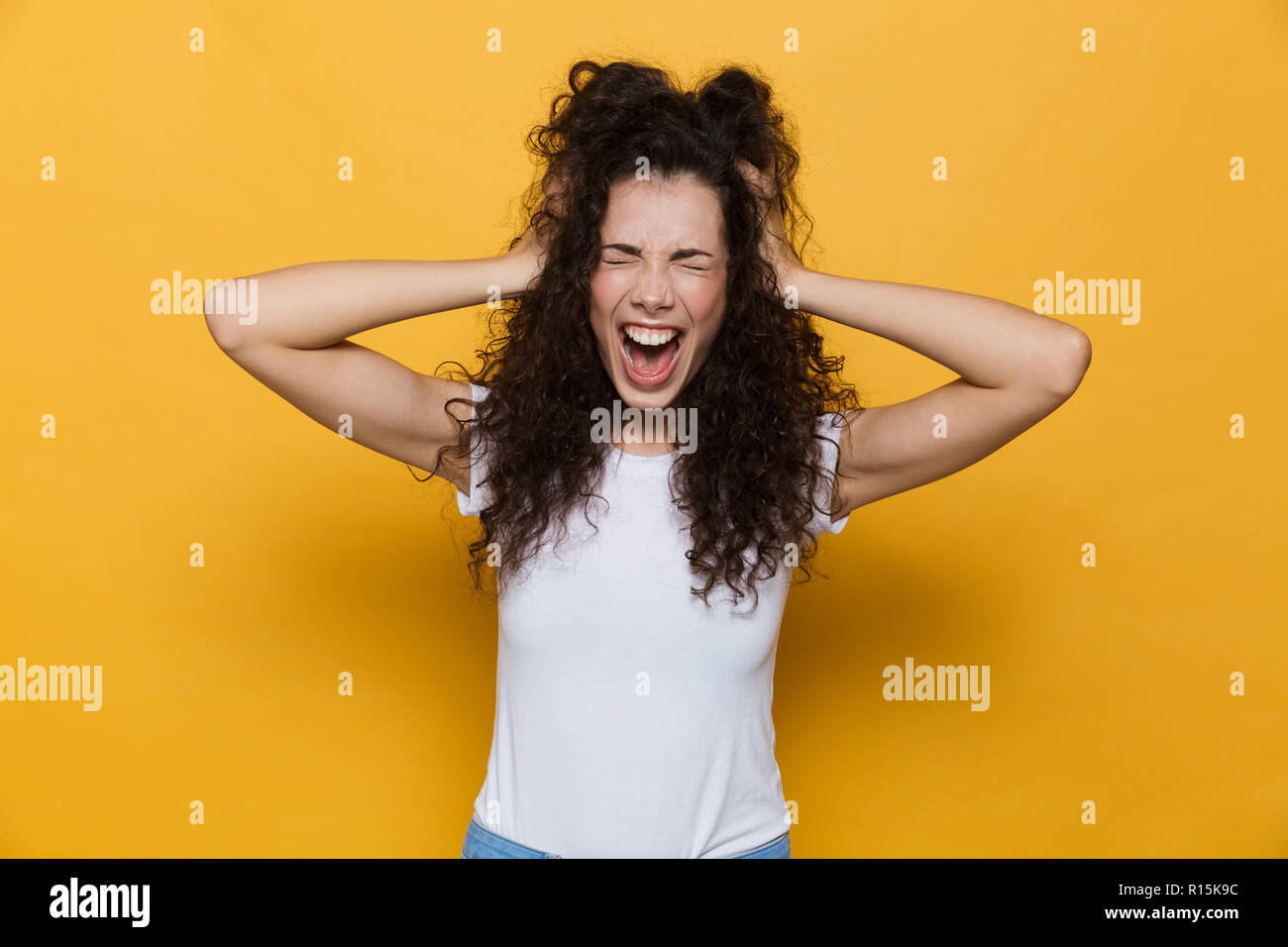 Image of screaming excited young cute woman posing isolated over yellow ...