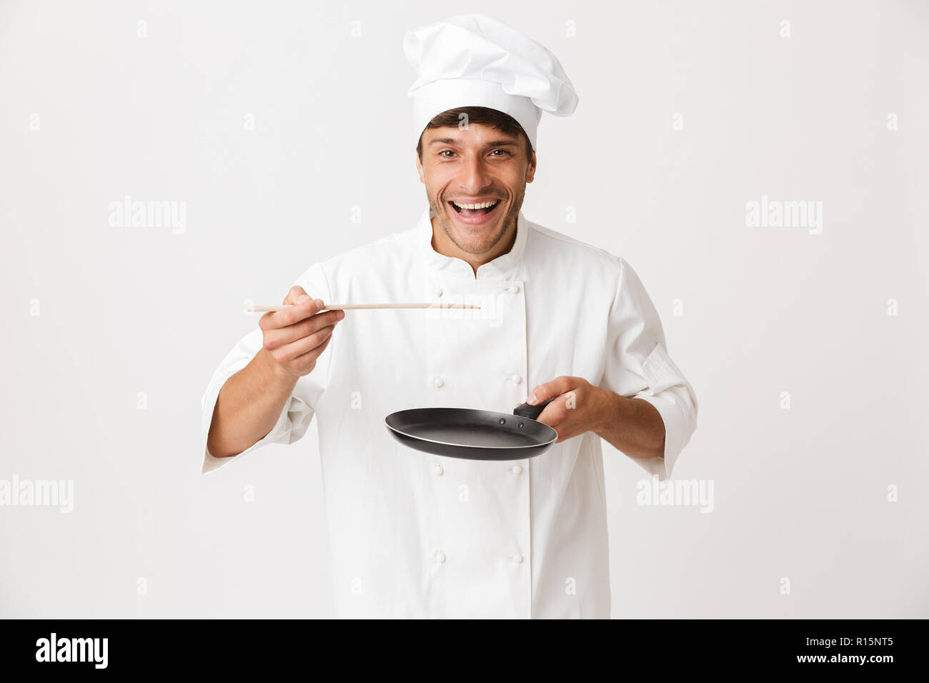 Image of handsome happy young chef man standing isolated over white ...
