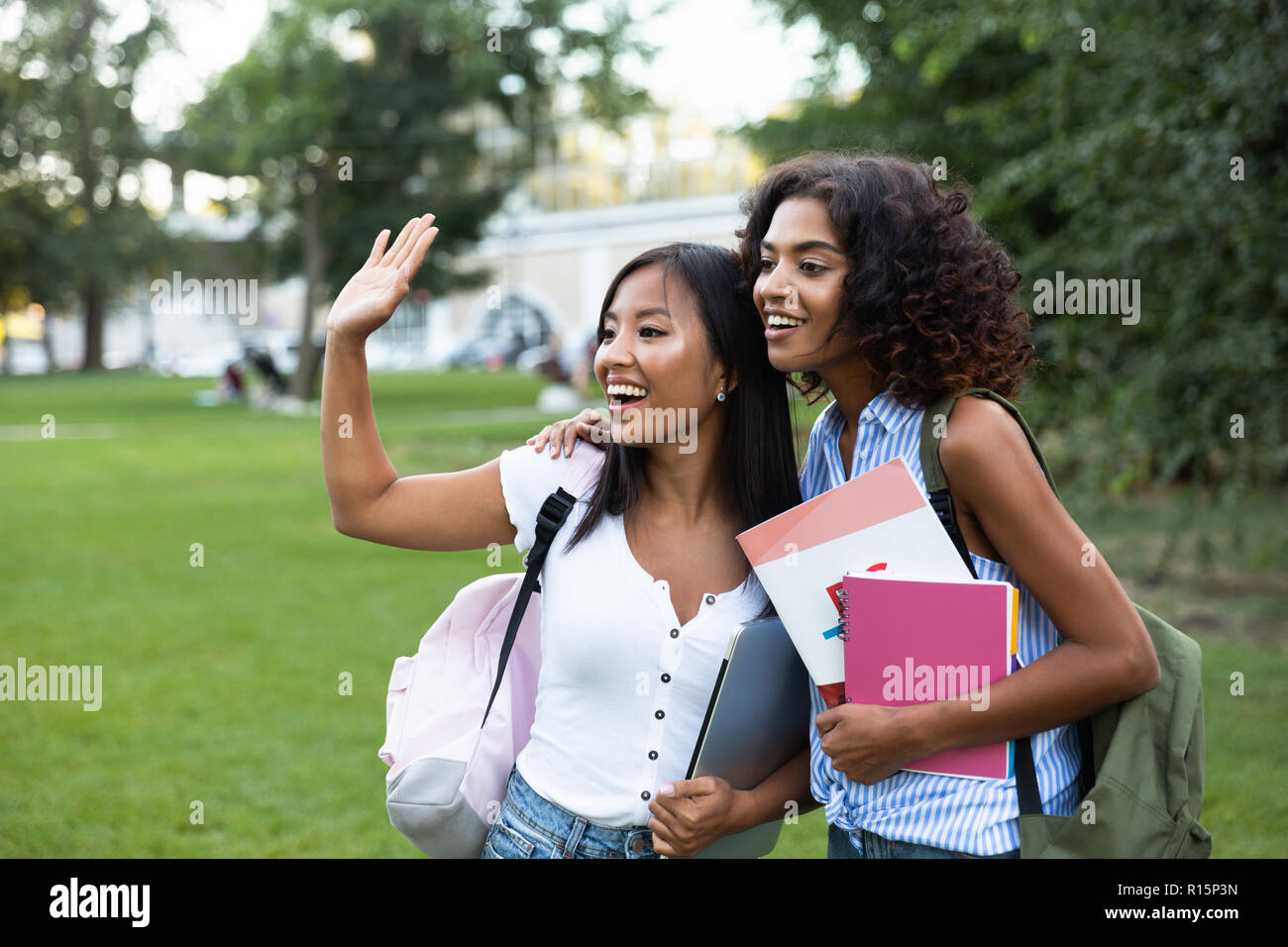 Young adult campus waving hi-res stock photography and images - Alamy