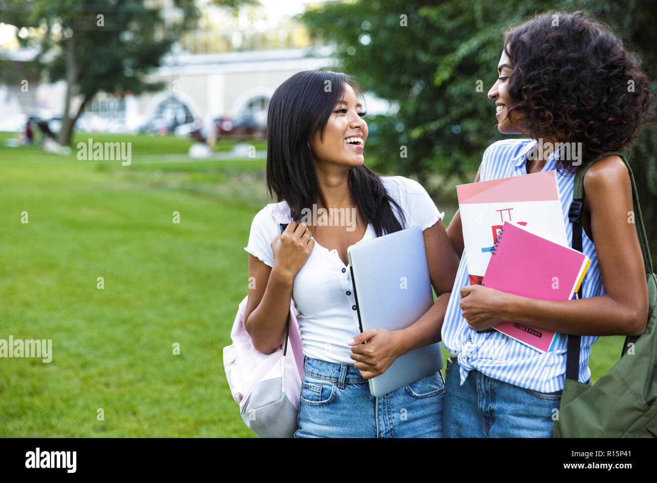 Two girls outside school talking hi-res stock photography and images ...