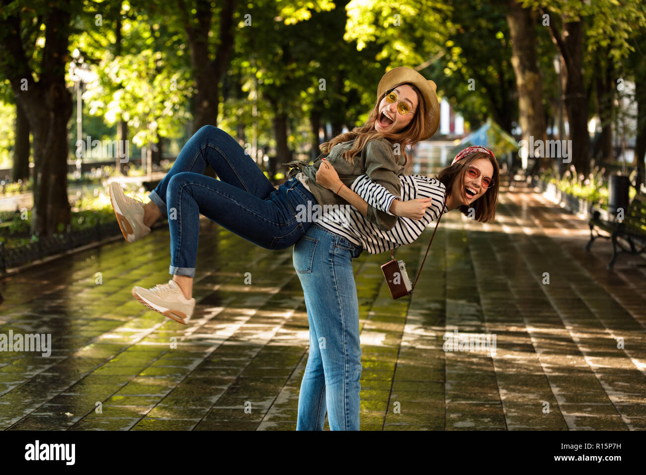 Image of excited pretty young happy women friends walking outdoors ...