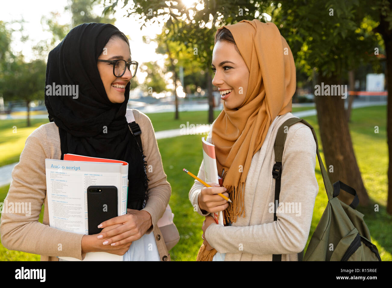 Happy saudi arab student holding hi-res stock photography and images ...