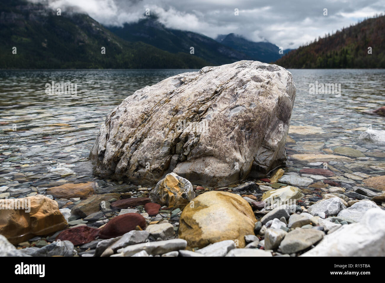 Unique rock on a peaceful lake in the Canadian wilderness Stock Photo ...