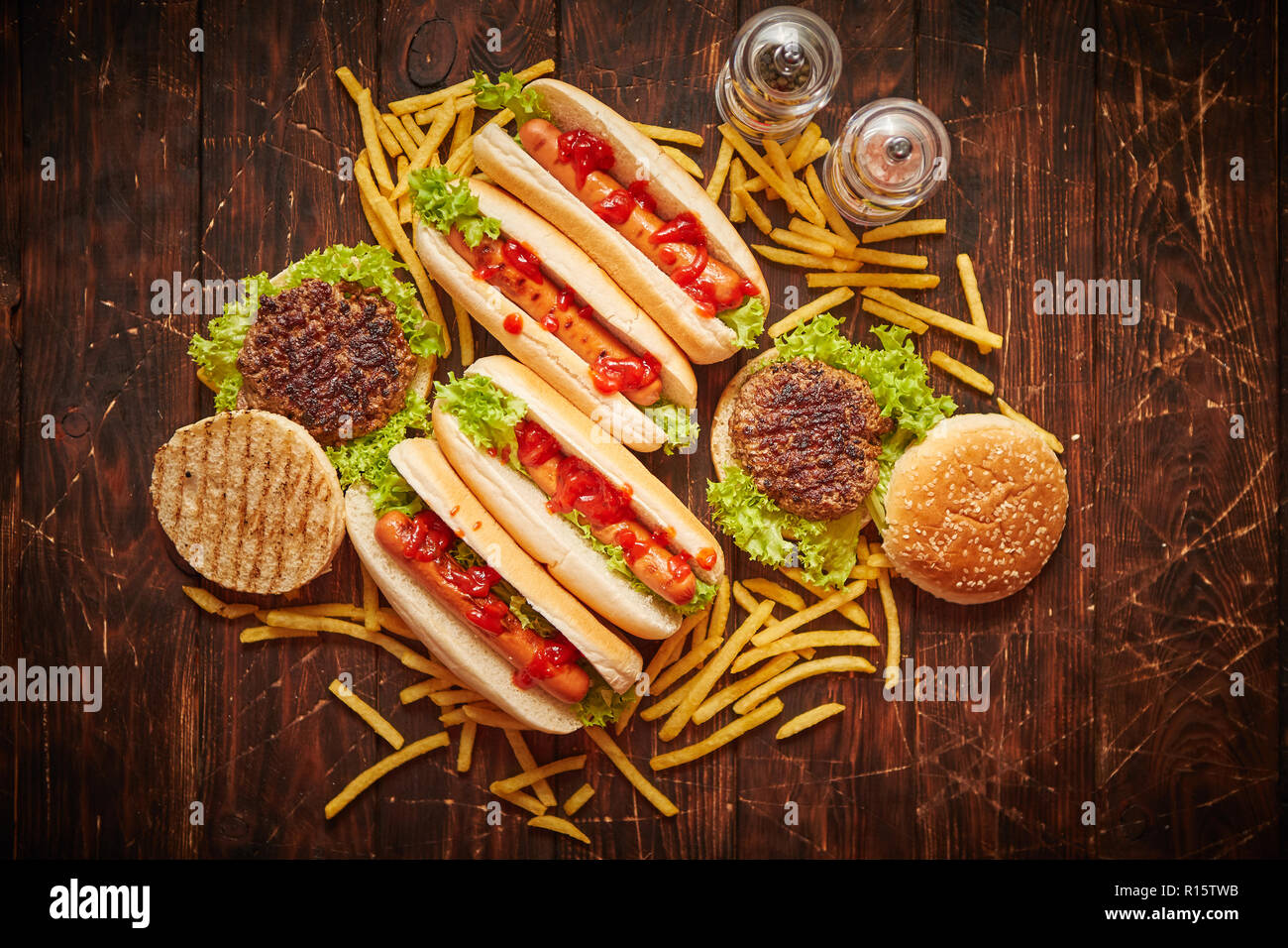 Hot dogs, hamburgers and french fries. Composition of fast food snacks ...