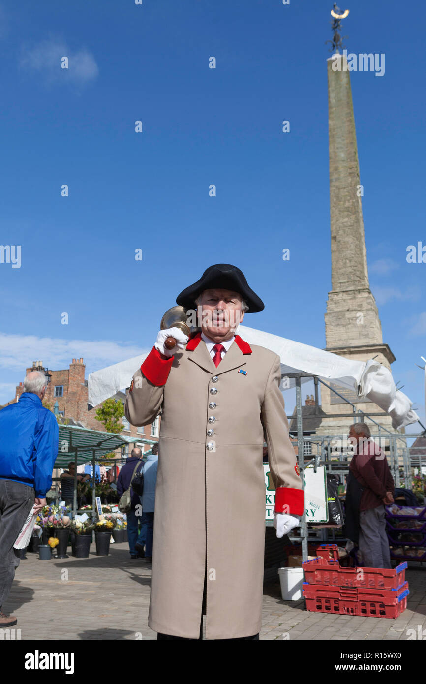 The watchman in Ripon market square with the market cross obelisk and ...