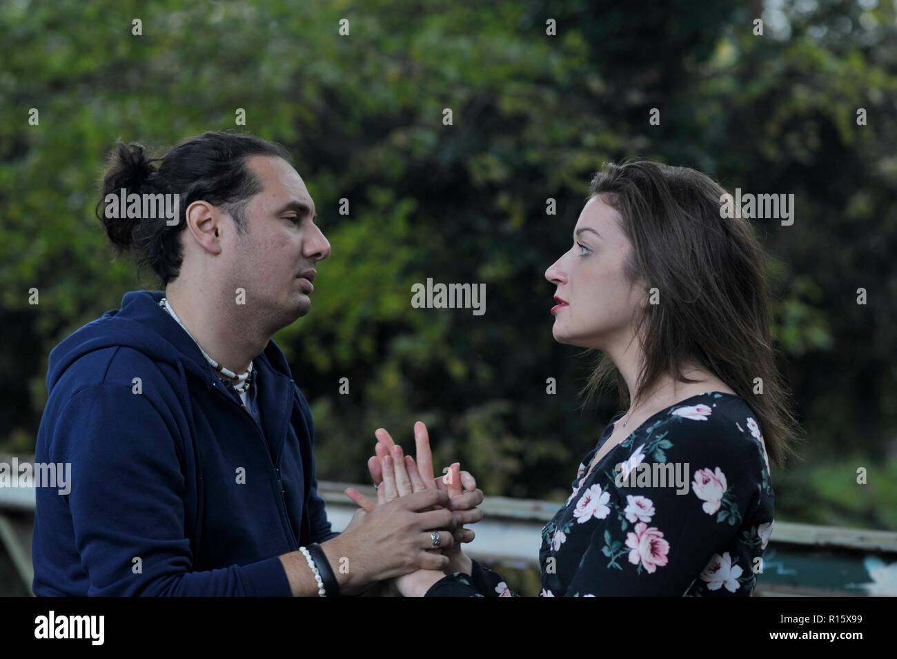 Young couple arguing in public Stock Photo - Alamy