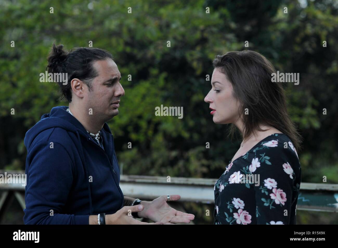 Young couple arguing in public Stock Photo - Alamy