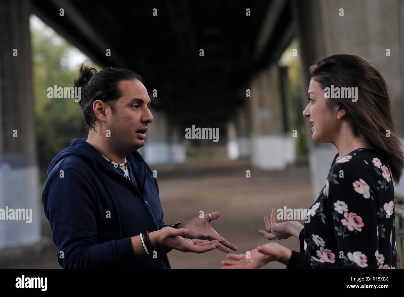 Young couple arguing in public Stock Photo - Alamy