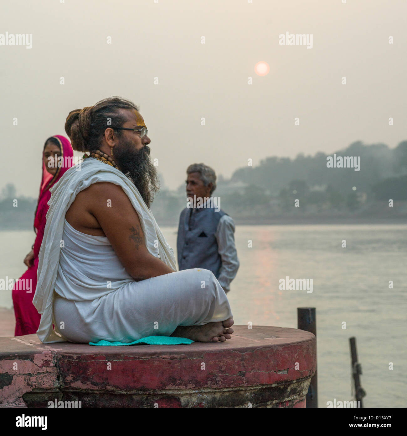 Hindu monk sitting at riverside, Rishikesh, Dehradun District ...