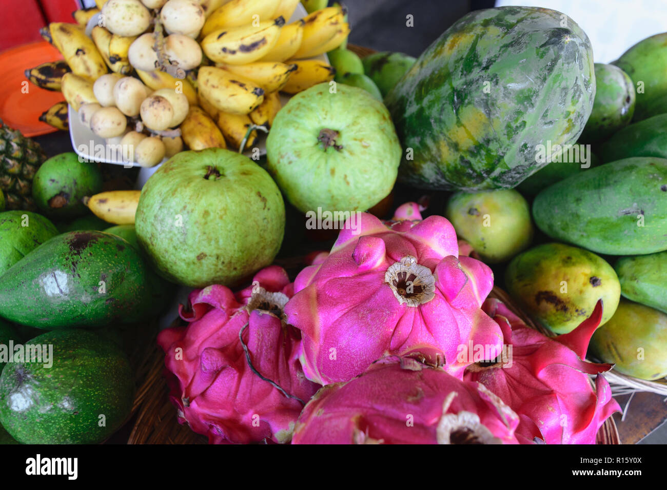 Background of various tropical fruit set in the market. Main camera ...