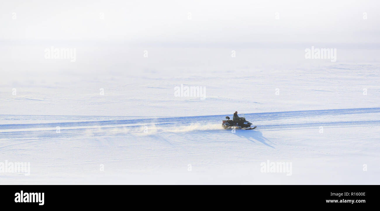 on snowy desert surface race on all-terrain snowmobile top view copy ...