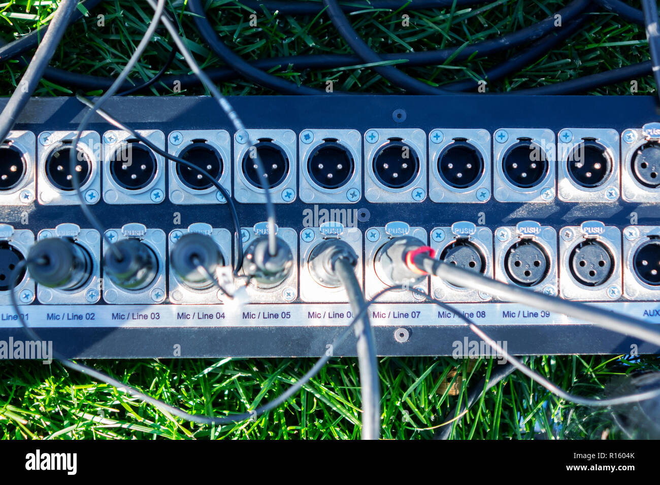 black microphone cables connected to the sound mixer in outdoor stage set Stock Photo - Alamy