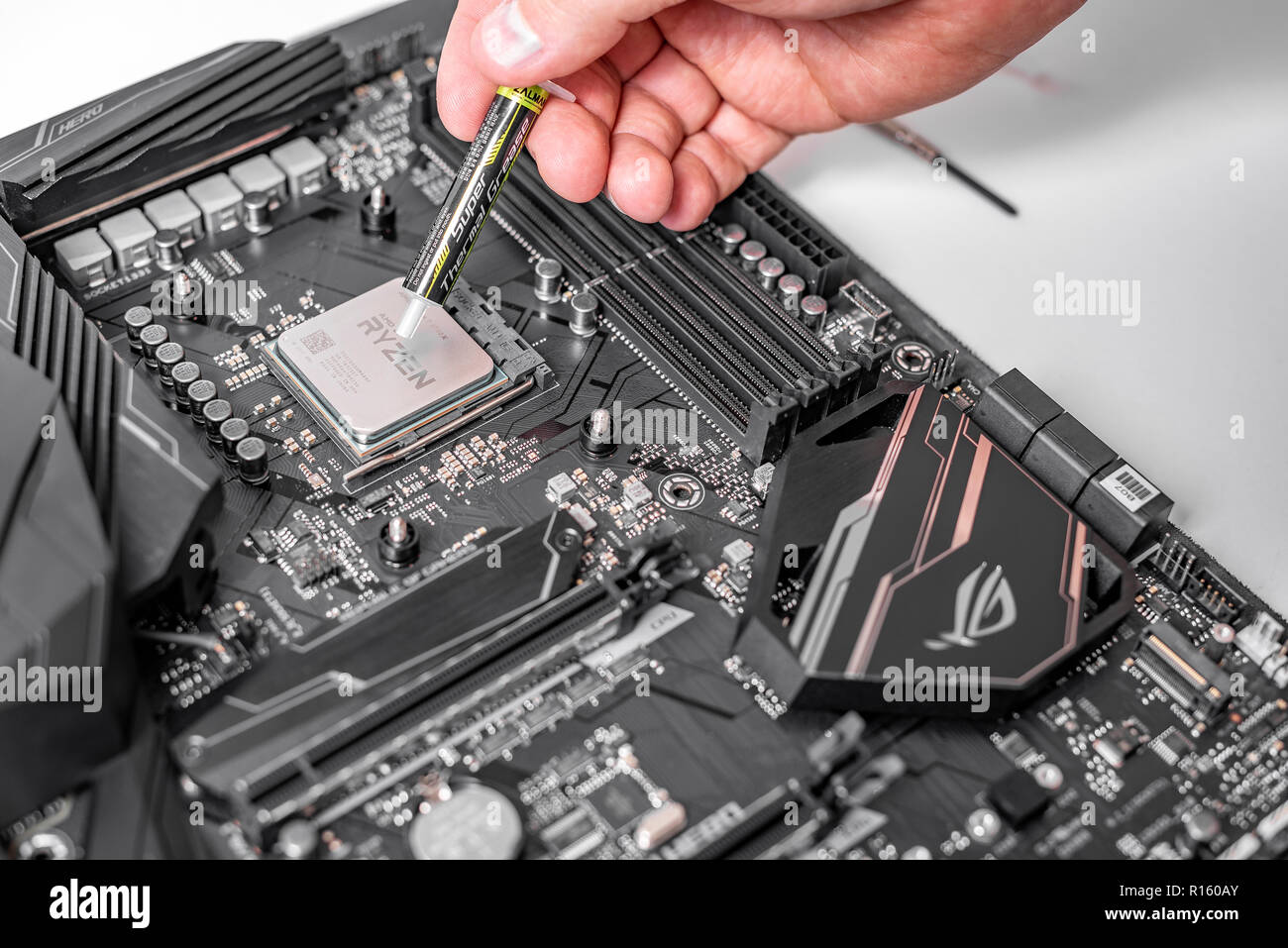 Engineer applying thermal paste on the computer board chip cpu Stock ...
