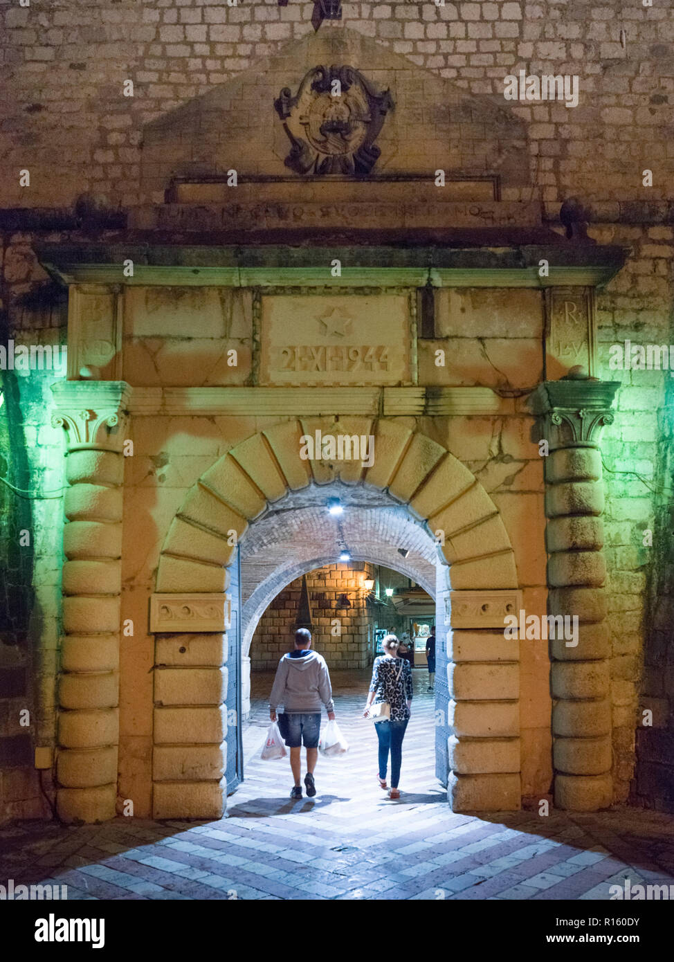 Entrance of Old Town Kotor with post-World War II sign, Bay of Kotor ...