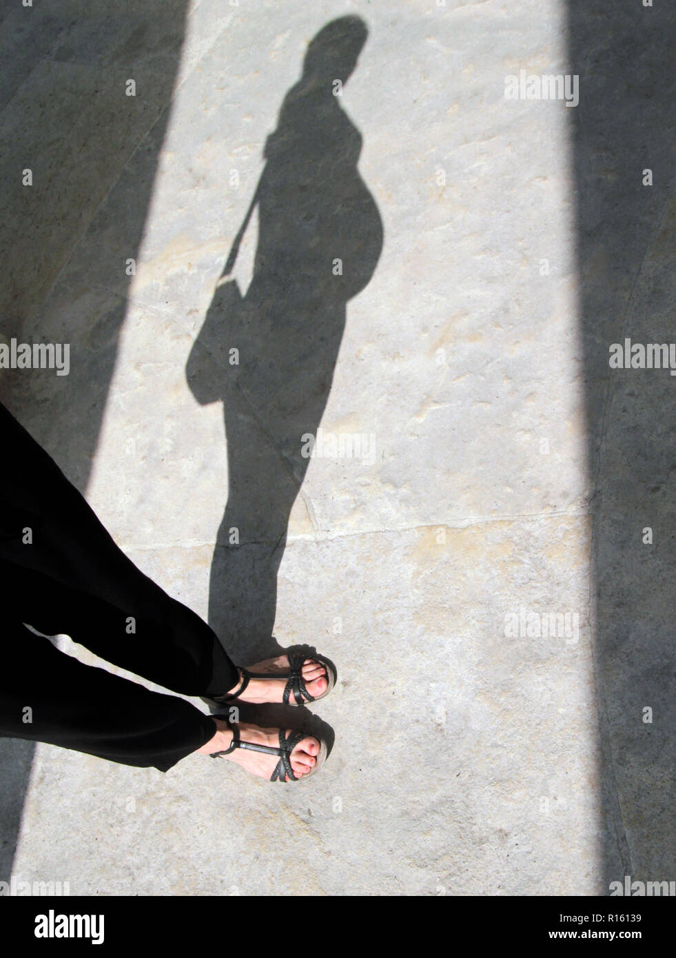 Shadow of a pregnant woman Stock Photo - Alamy