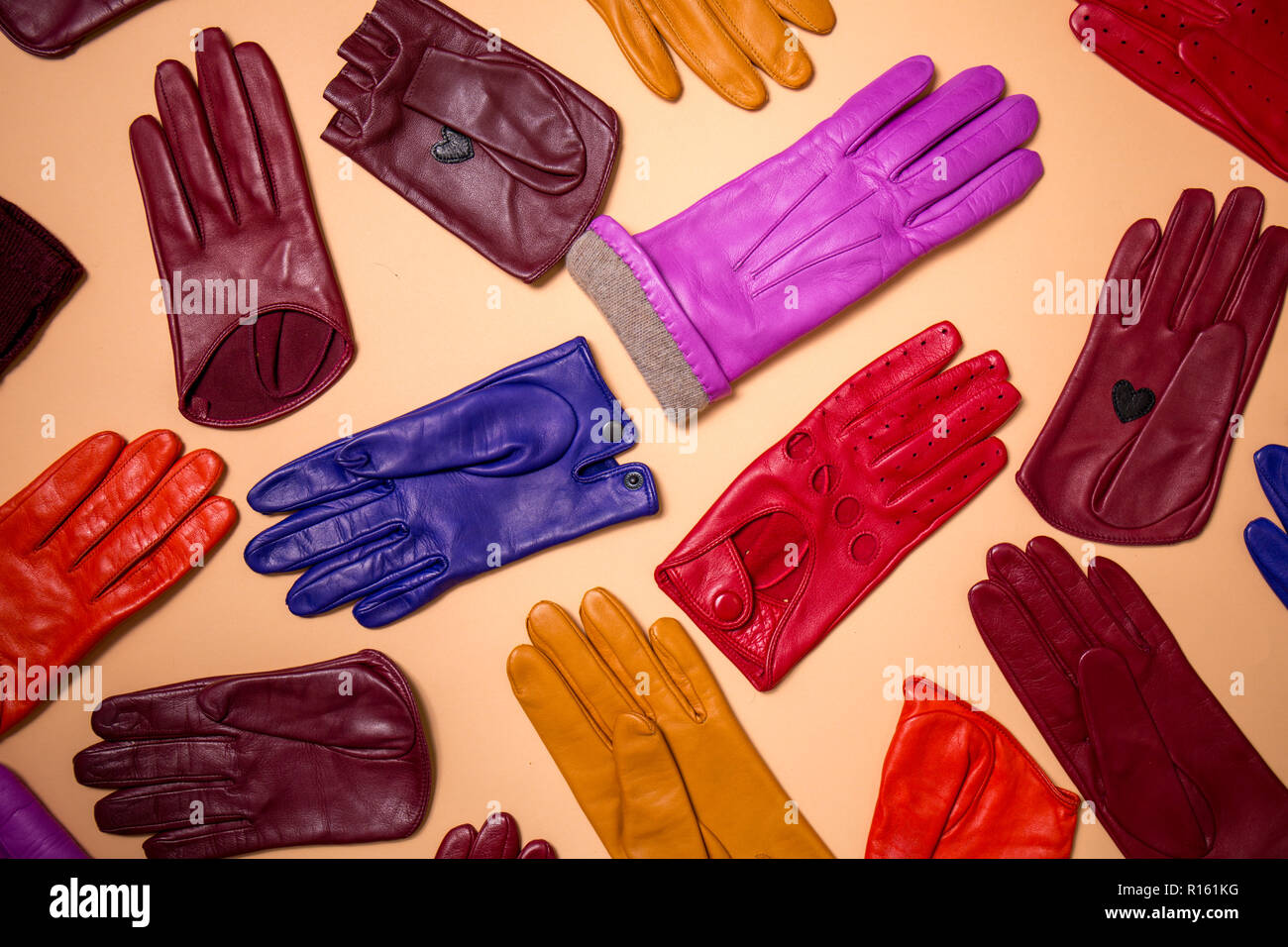 Many multicolored gloves, top view Stock Photo - Alamy