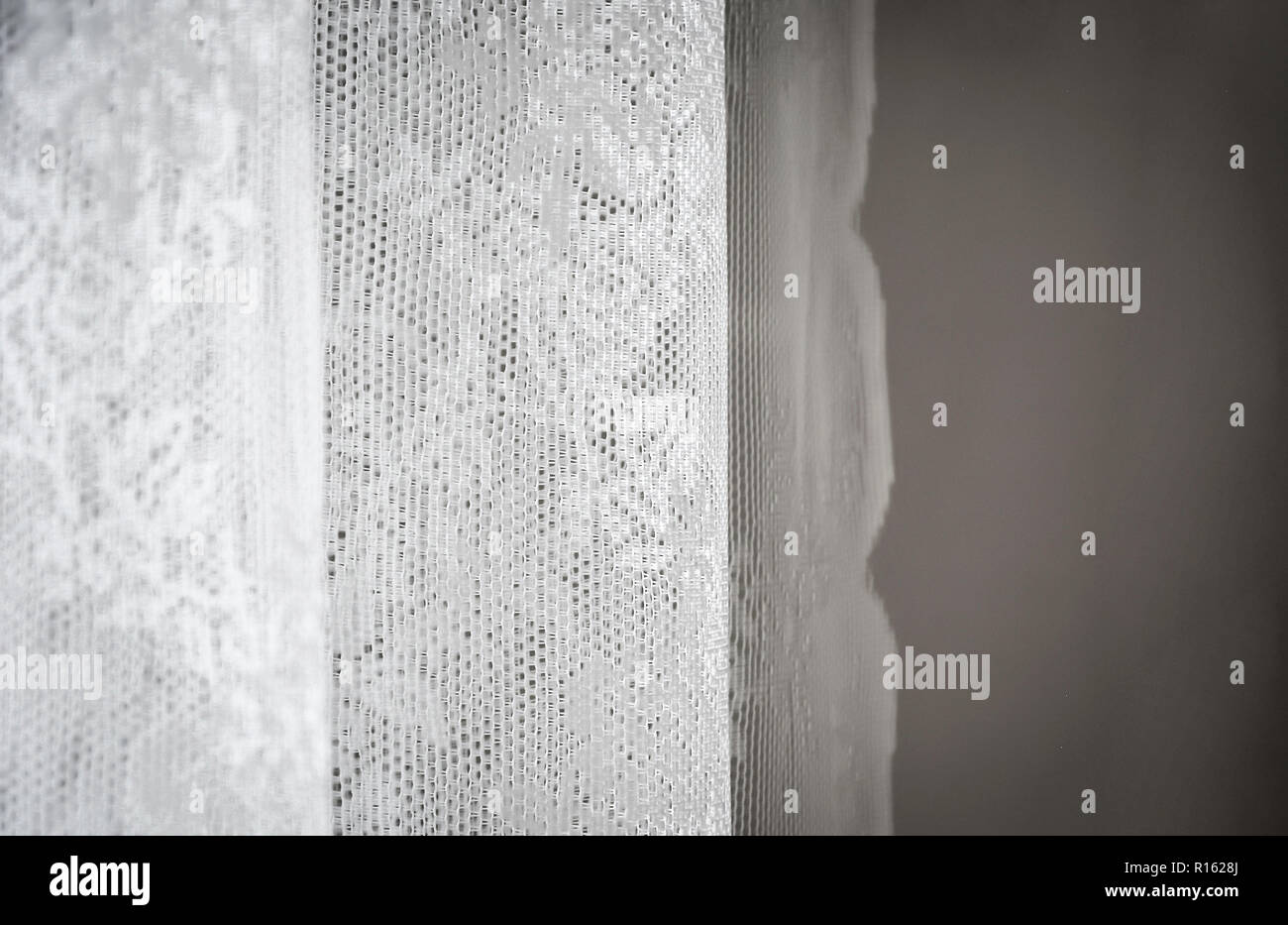 White curtain decorated with sewed floral pattern in lace. Interior ...