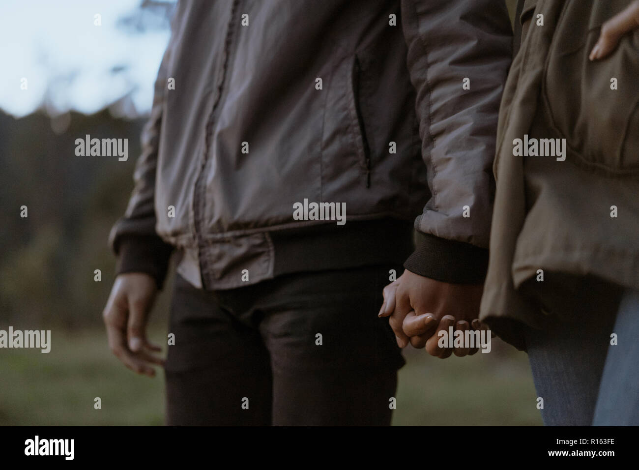 woman and man hand holding together Stock Photo - Alamy