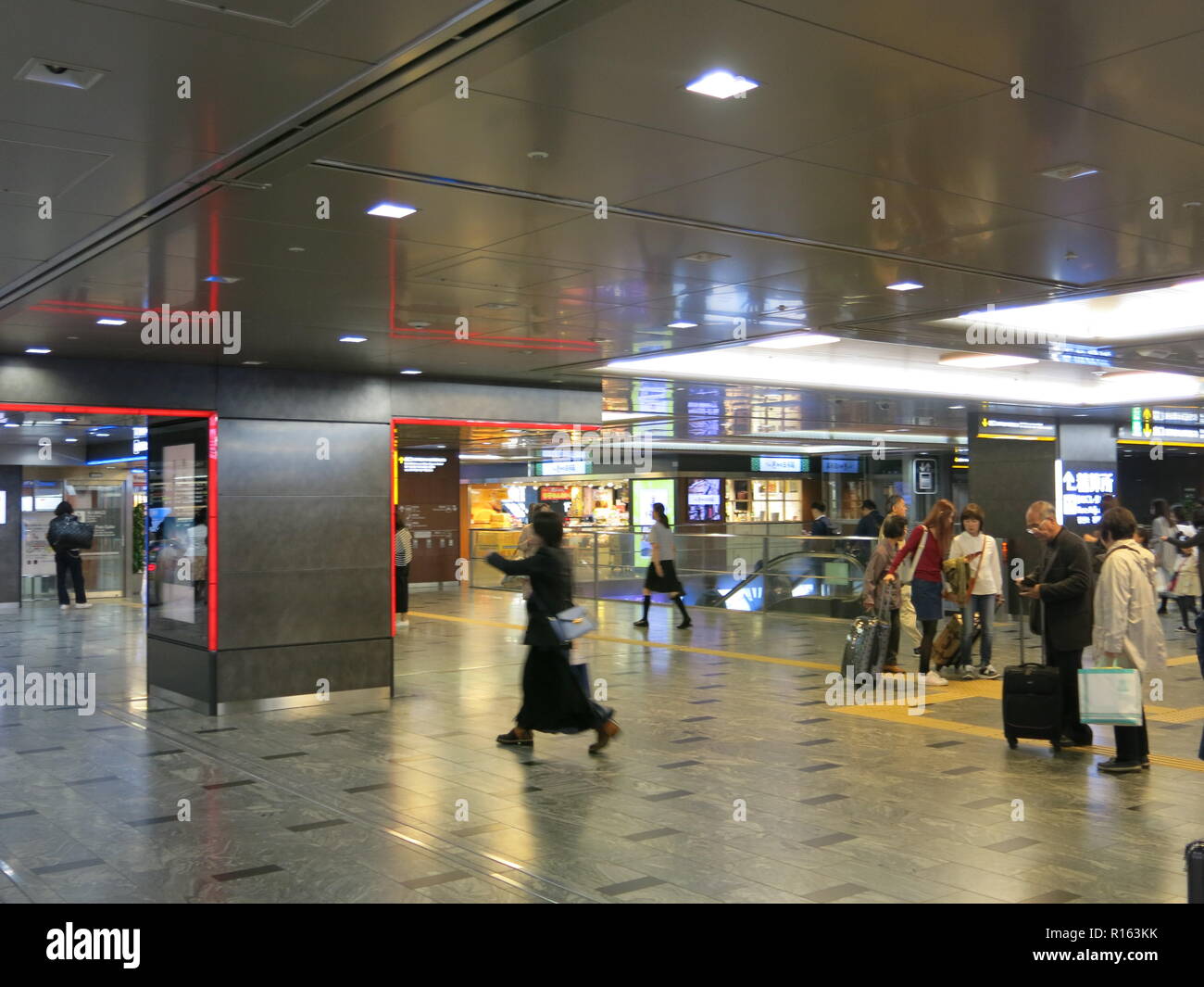 The large, open concourse at Hakata Station has shopping and restaurant ...