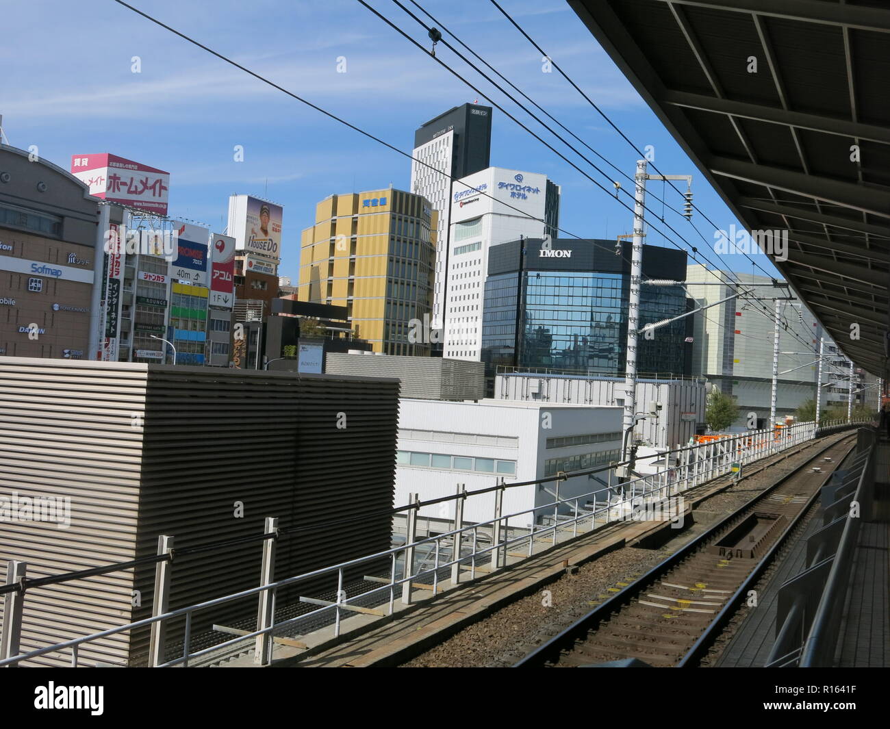 A view of the train tracks and cityscape from the railway station in ...