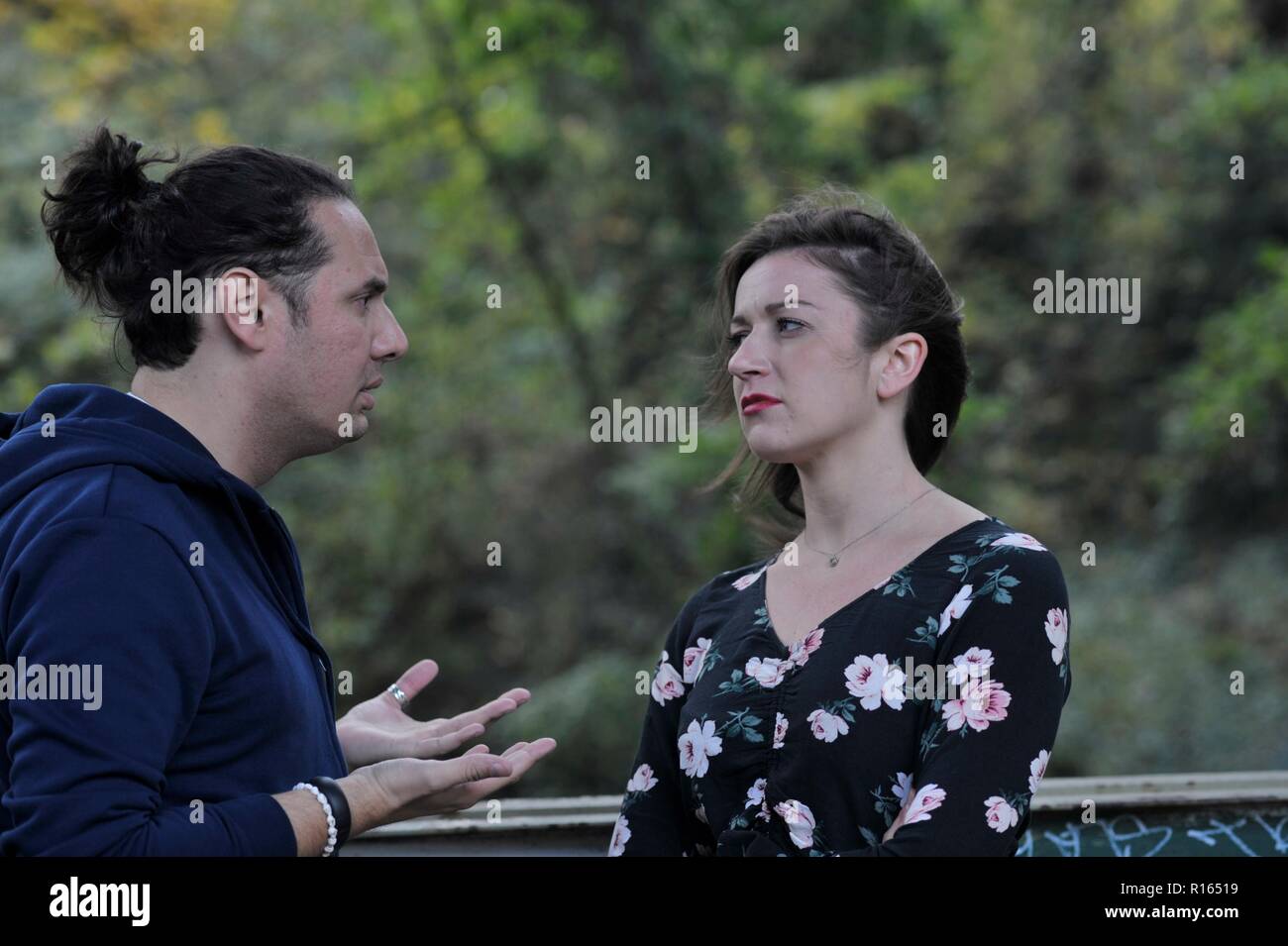 Young couple arguing in public Stock Photo - Alamy