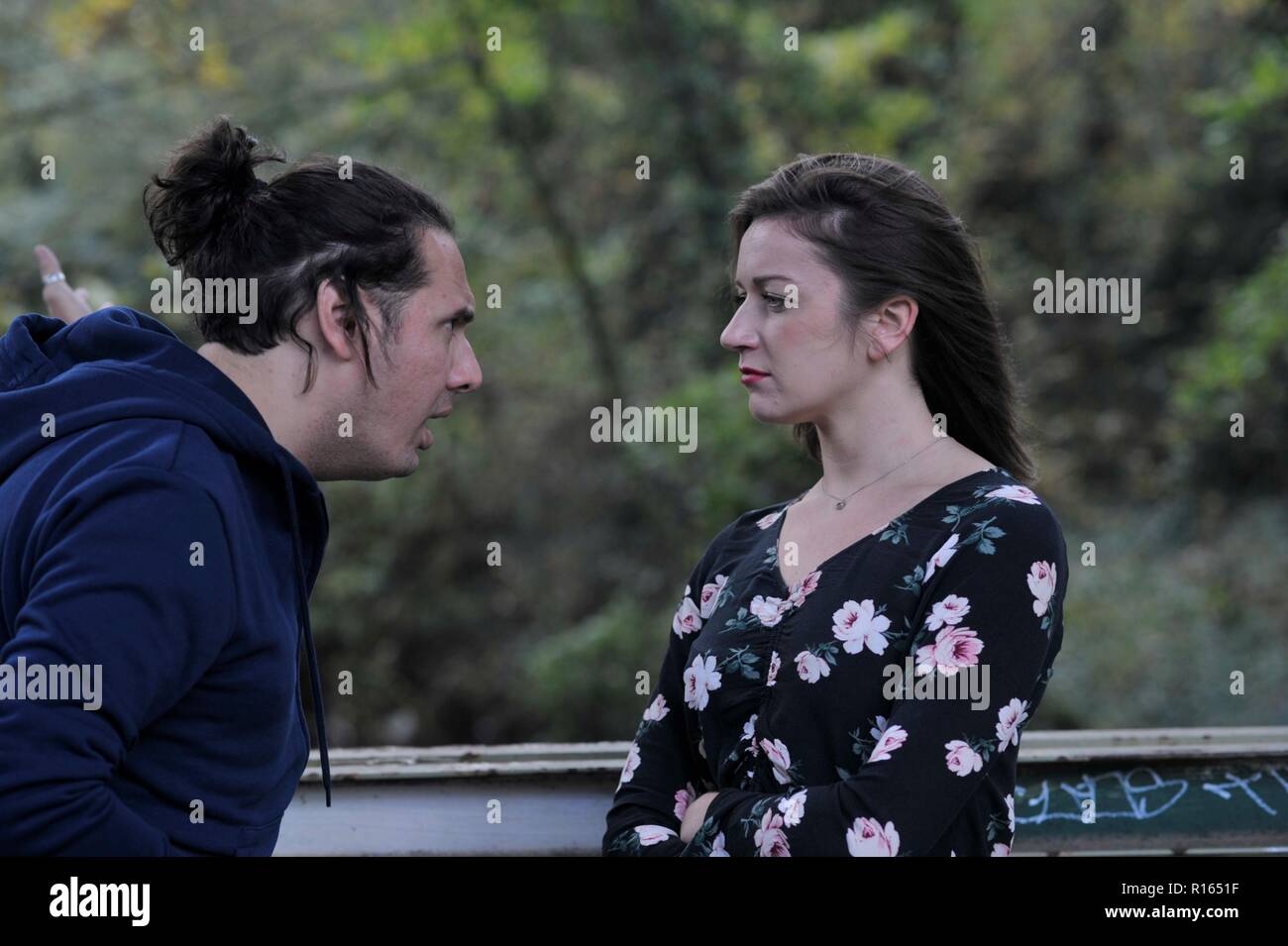 Young couple arguing in public Stock Photo - Alamy