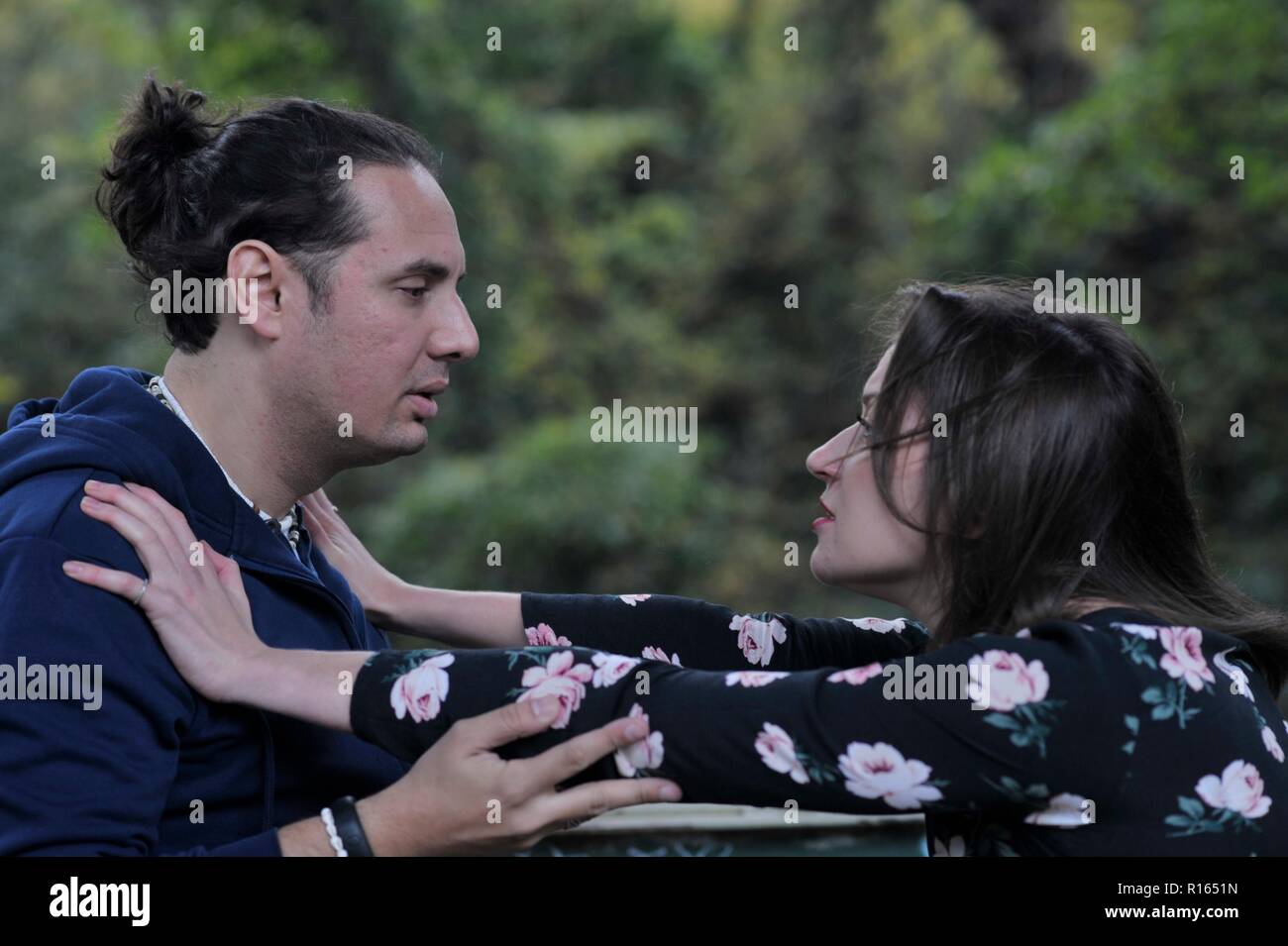 Young couple arguing in public Stock Photo - Alamy