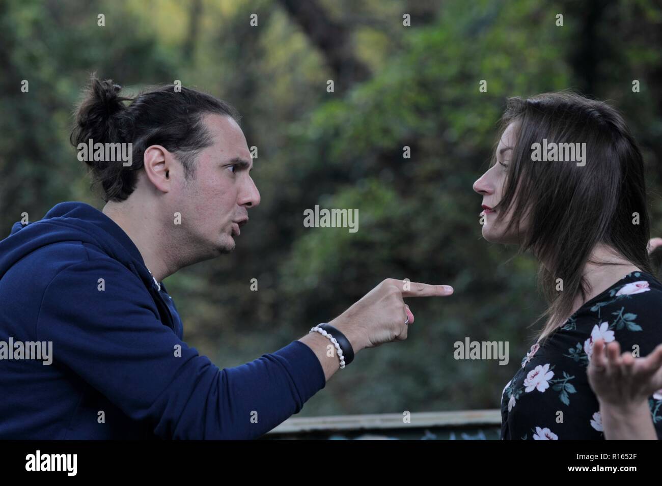 Young couple arguing in public Stock Photo - Alamy