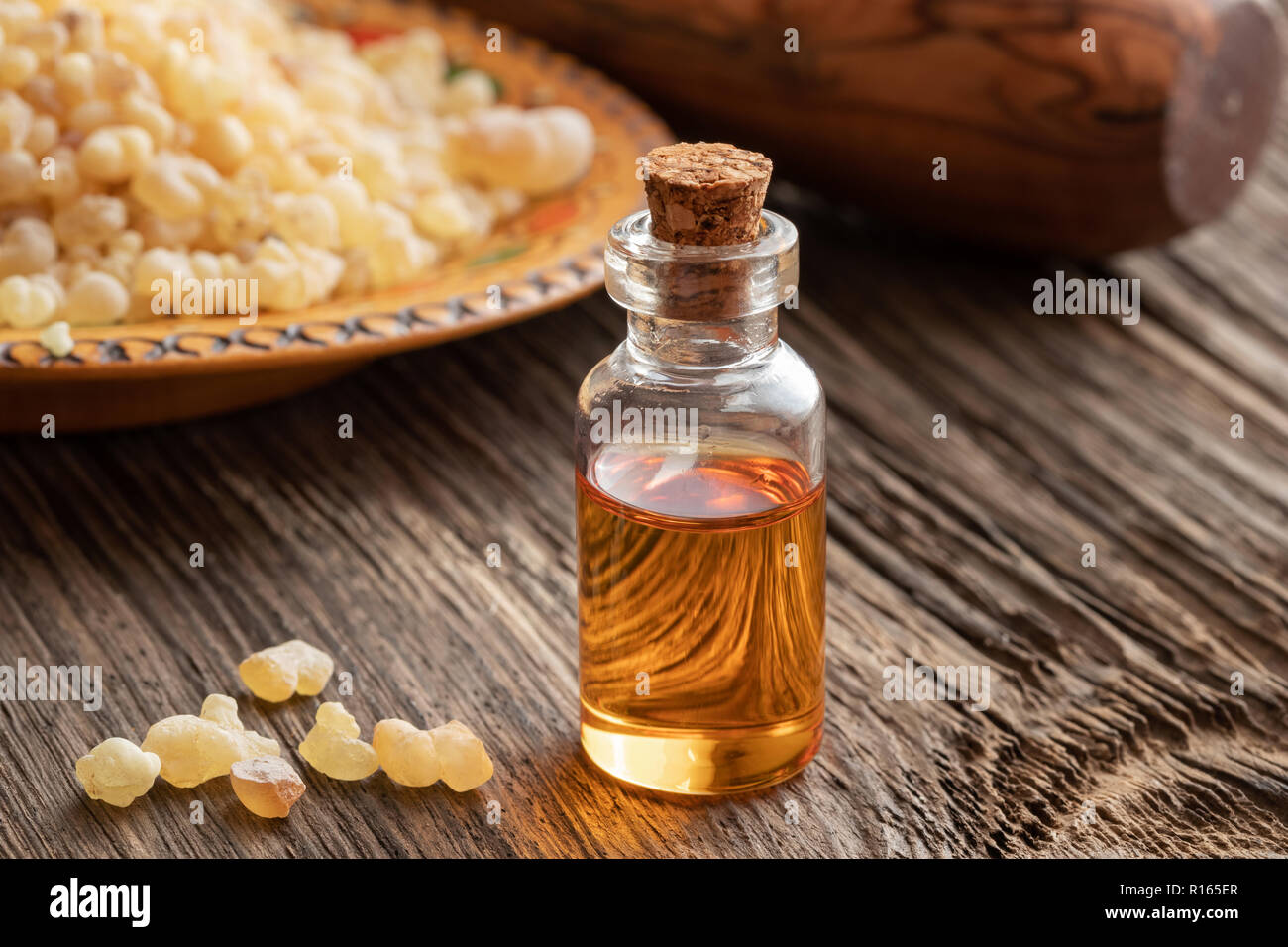 A bottle of essential oil with frankincense resin Stock Photo - Alamy