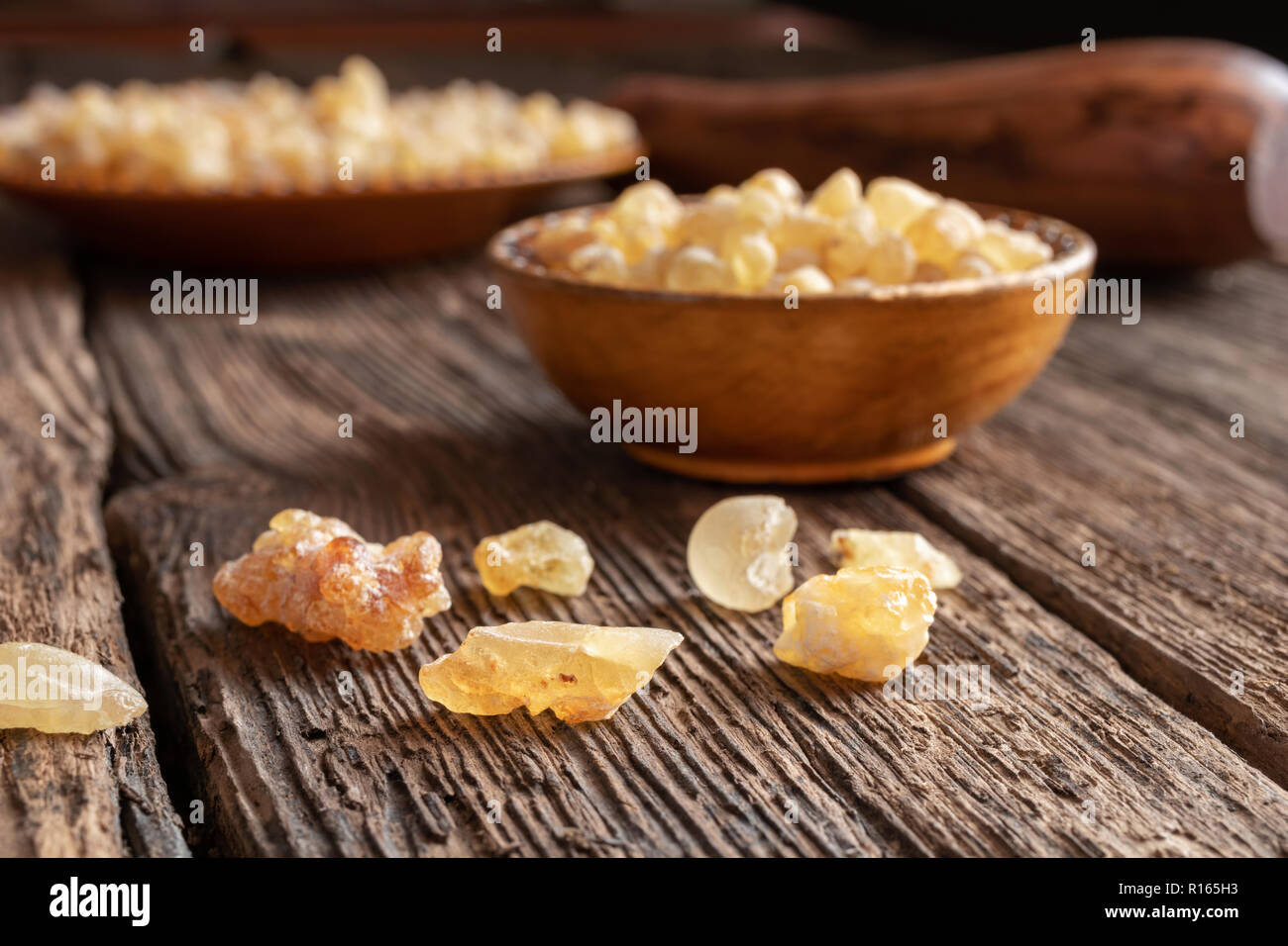 Frankincense resin crystals on a wooden background Stock Photo - Alamy