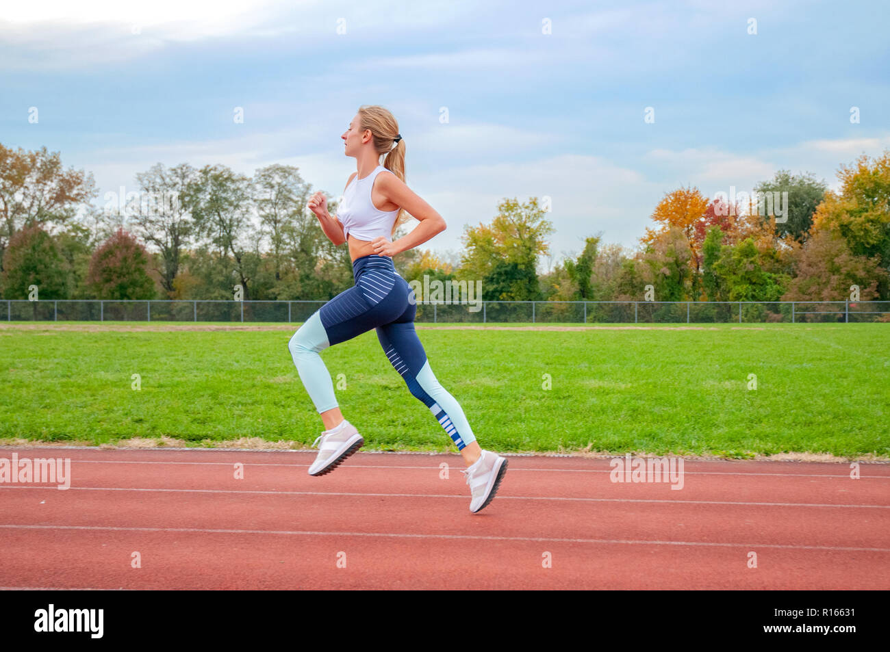 Healthy lifestyle young fitness woman running. Female runner practicing ...