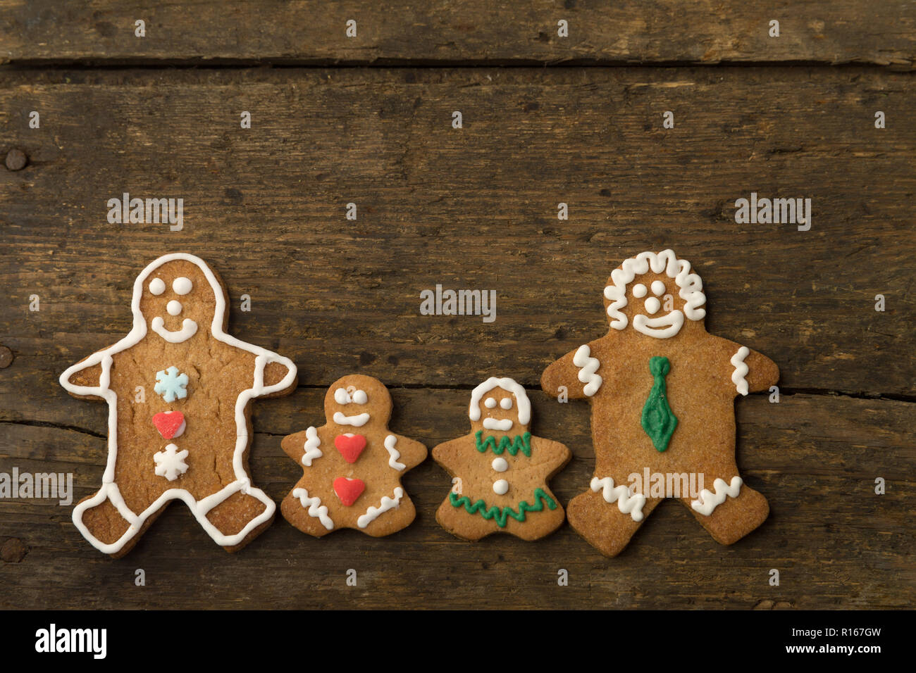 Edible gingerbread family with children on a rustic wooden board Stock ...